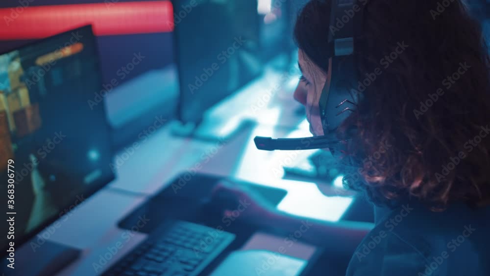 Pro Girl Plays Computer FPS Shooter Video Game on a Championship ...