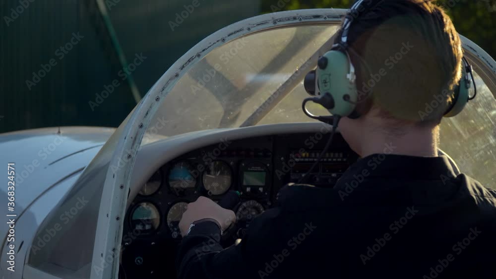 Professional pilot hold the helm and control panel of an airplane ...