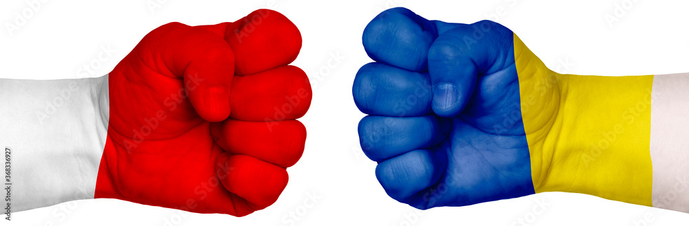 Two hands are clenched into fists and are located opposite each other ...