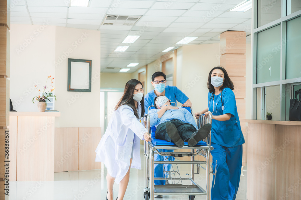 Emergency department, doctors and surgeons team move seriously injured ...