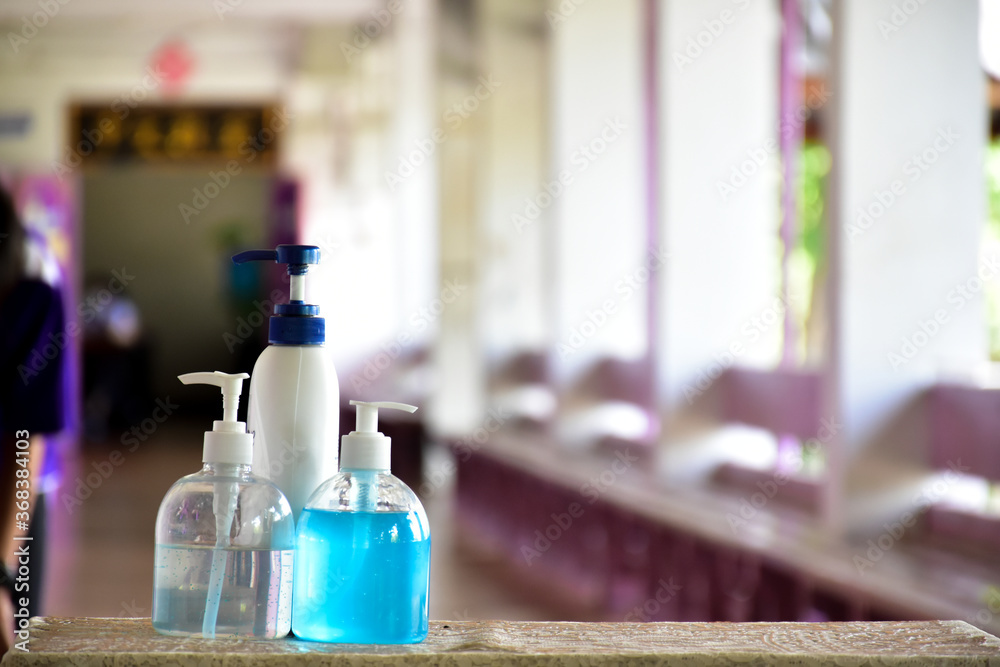 New normal, hand sanitizer, alcohol gel and hand soap on table in front ...