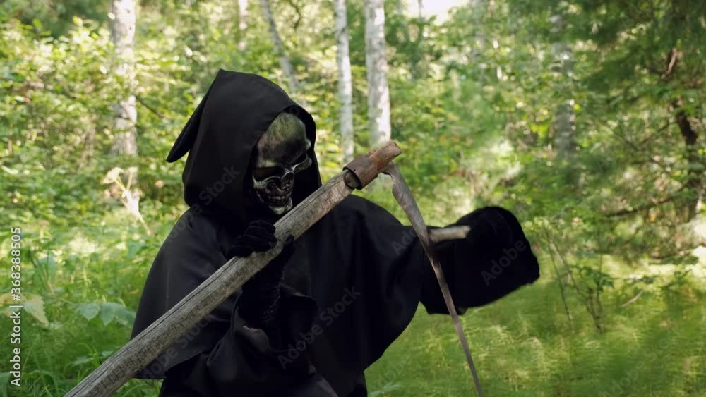 Grim Reaper Sharpening a Scythe while Sitting on the Bench in a City ...