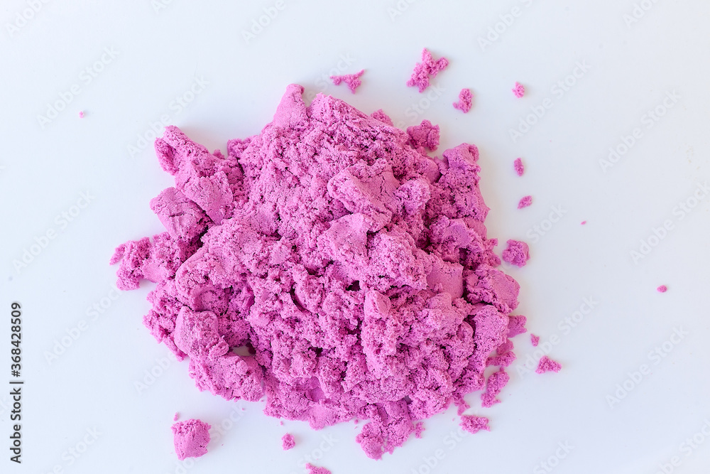 Kinetic sand of pink color on an isolated white background. Sand for ...