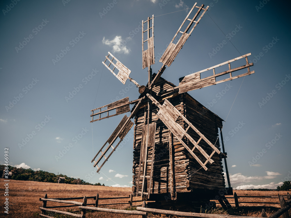 The traditional ukrainian wooden wind mill in the Pirogovo historical ...