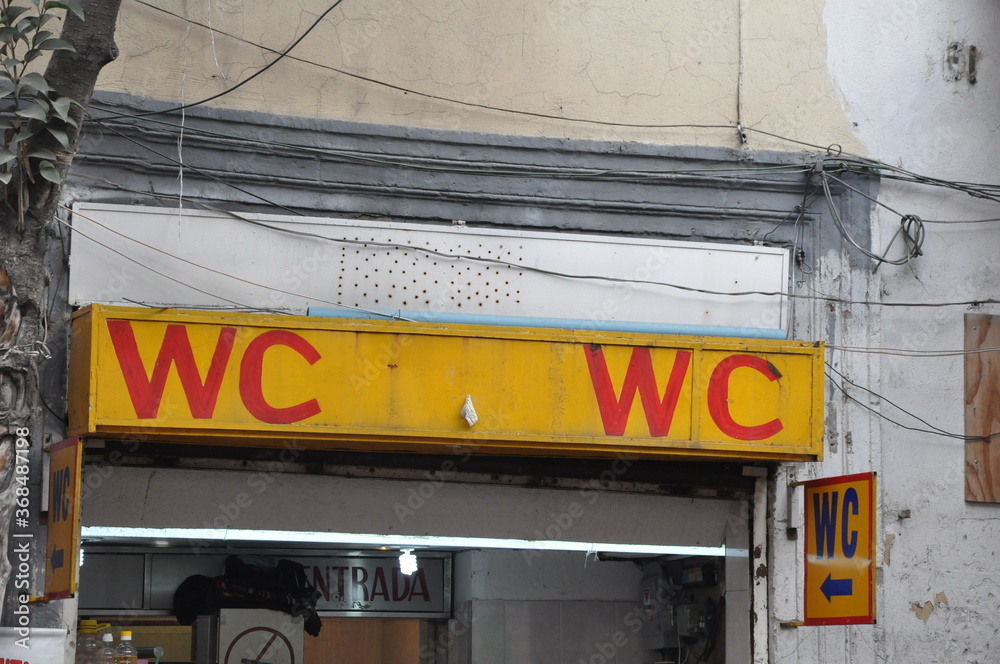 WC Toilet sign against the background of mexico city, Handpainted WC ...