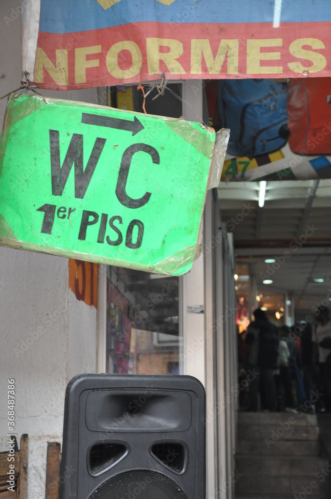 WC Toilet sign against the background of mexico city, Handpainted WC ...