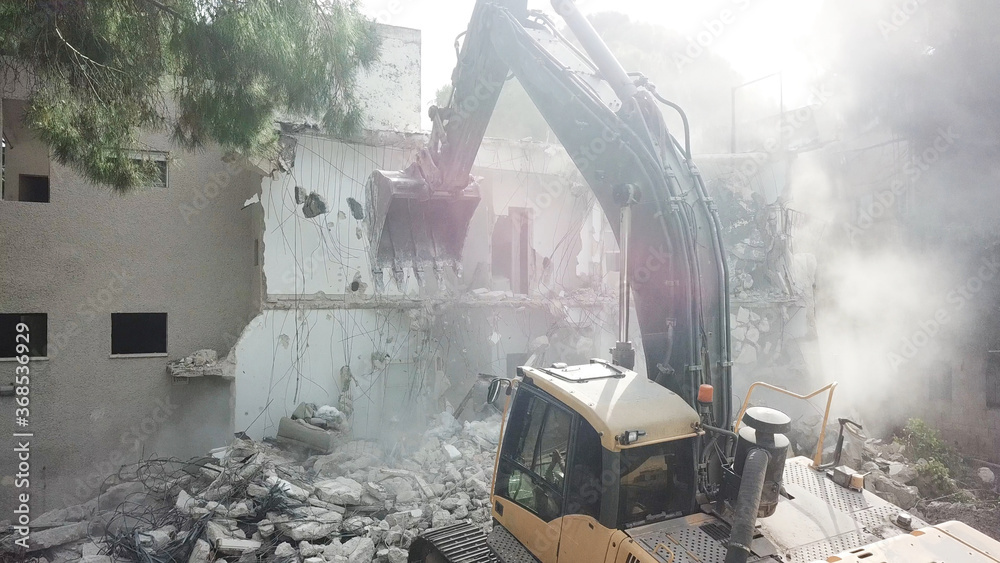 Urban Regeneration. Demolition of a building for new construction ...