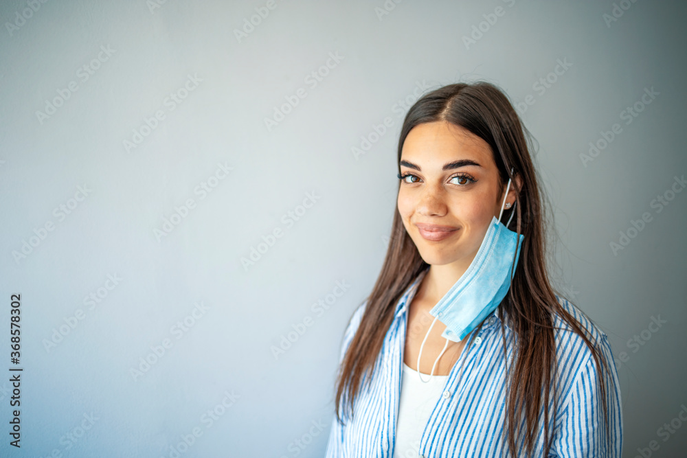 The woman show the wrong way to wear Hygienic mask. The girl ...