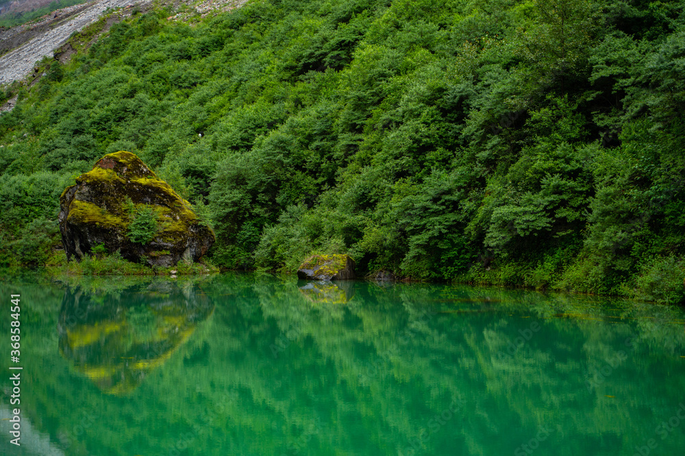 The Jade lake in Conch Gully of Sichuan, China, with reflection. Stock ...