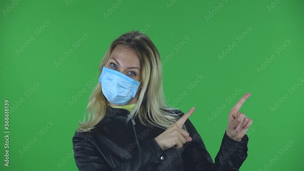 Portrait of beautiful young woman in medical protective face mask ...
