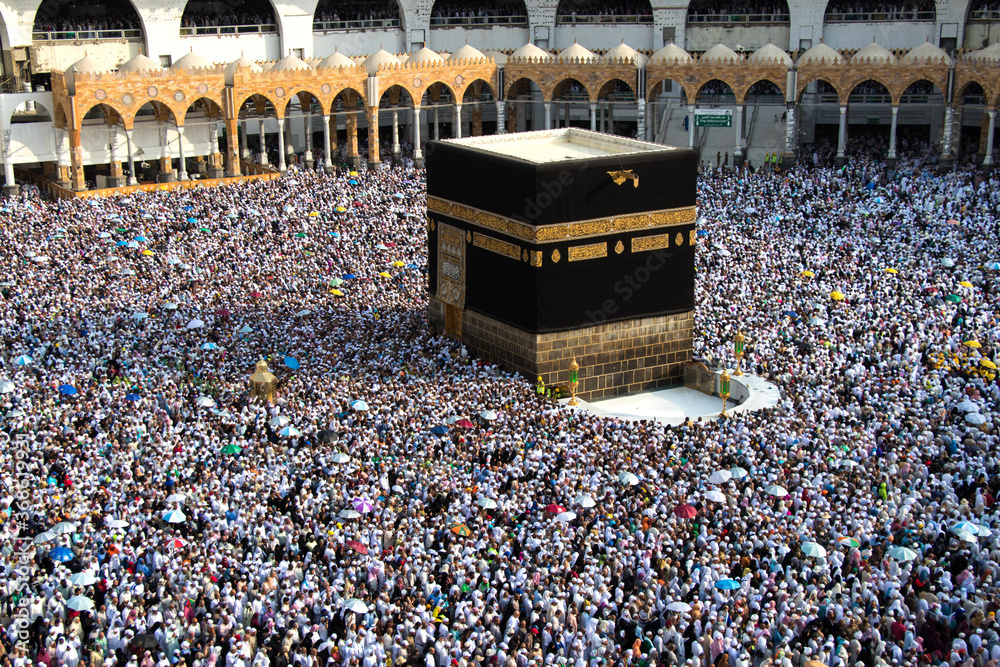 Holy Kaaba. Crowd of muslims walking around Kaaba for Tawaf during Hajj ...