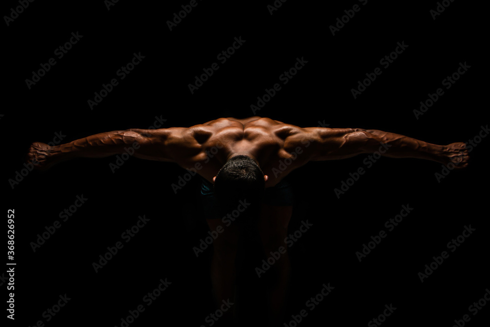 The bodybuilder has spread both arms and snapped a photo from above ...