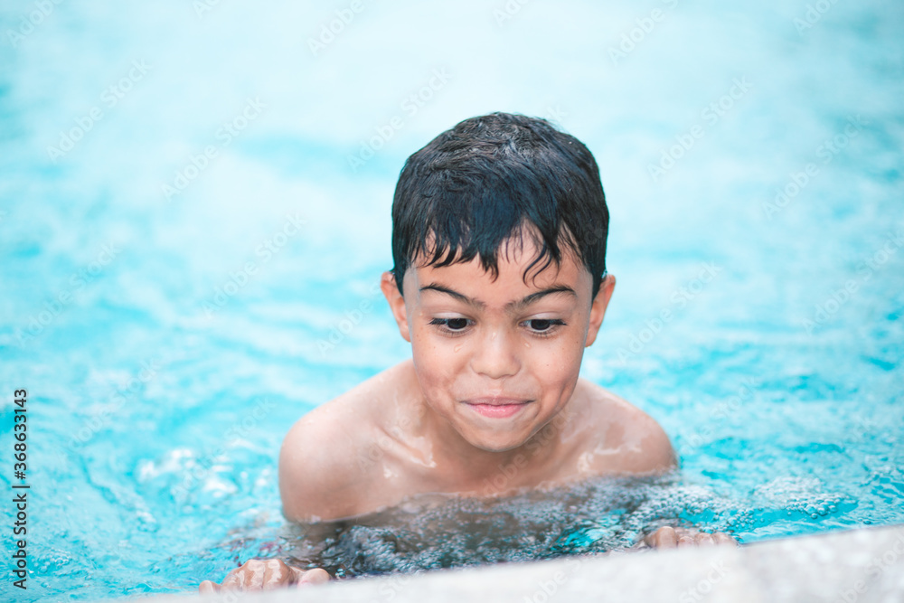 Little boy in swimming pool Stock Photo | Adobe Stock