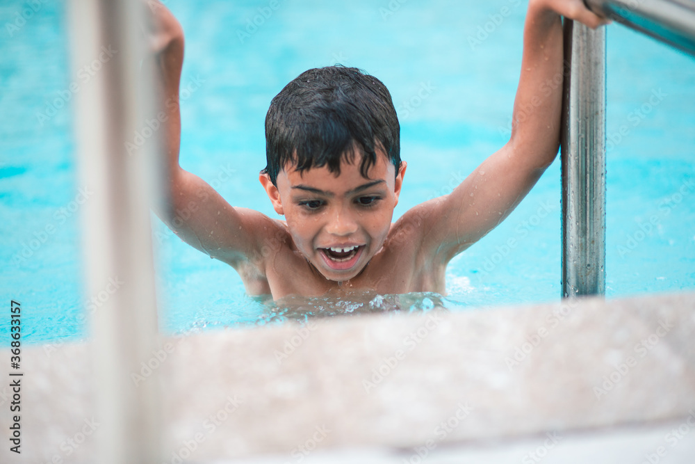 Little boy in swimming pool Stock Photo | Adobe Stock