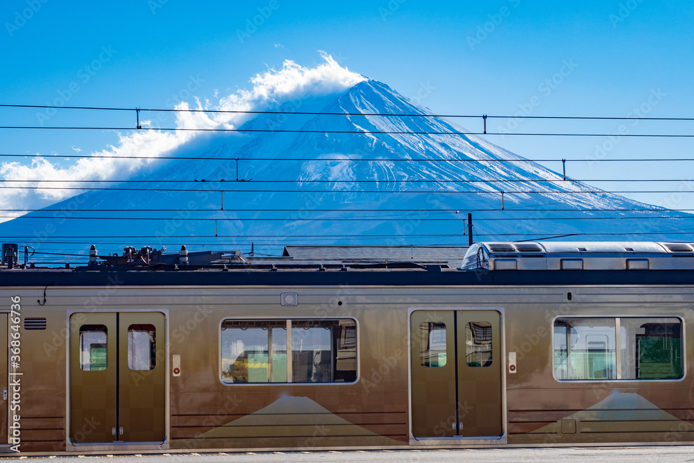Japan. Train on the background of Mount Fuji. Fujiyama volcano on a ...