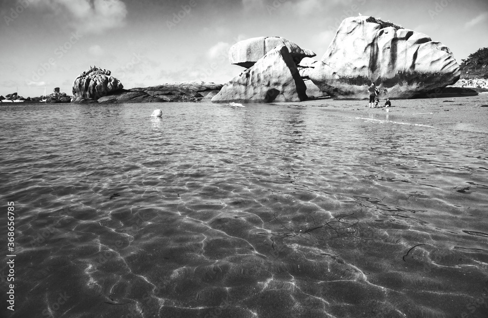 People relaxing at beautiful beach at Pink Granite Coast during summer ...