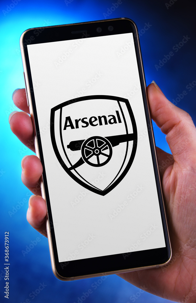 Hand holding smartphone displaying logo of Arsenal FC Stock Photo ...