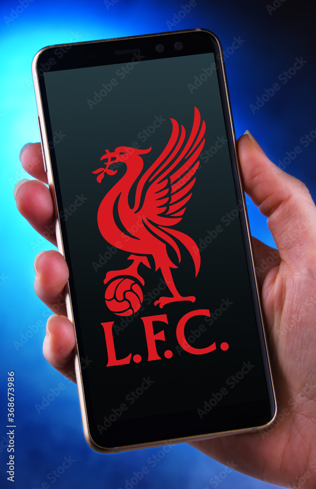 Hand holding smartphone displaying logo of Liverpool FC Stock Photo ...