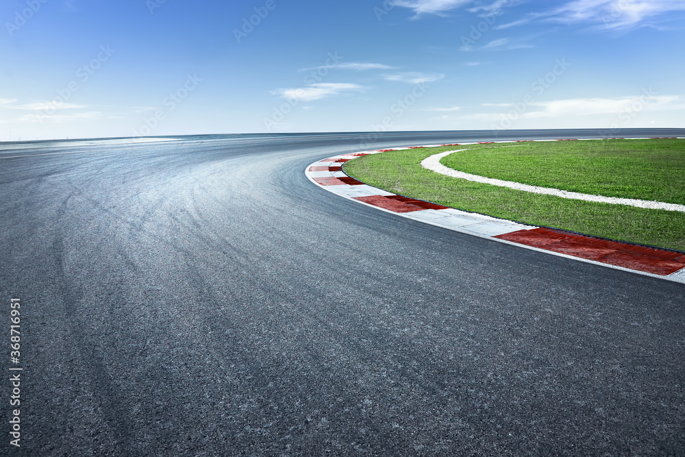 Asphalt race track with dramatic turning curve corner. Stock Photo ...