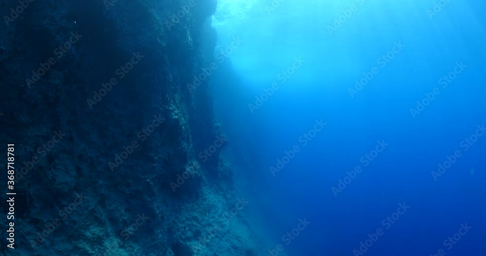 choppy water wavy sea underwater wavwe hit on rocks and makes foam on ...
