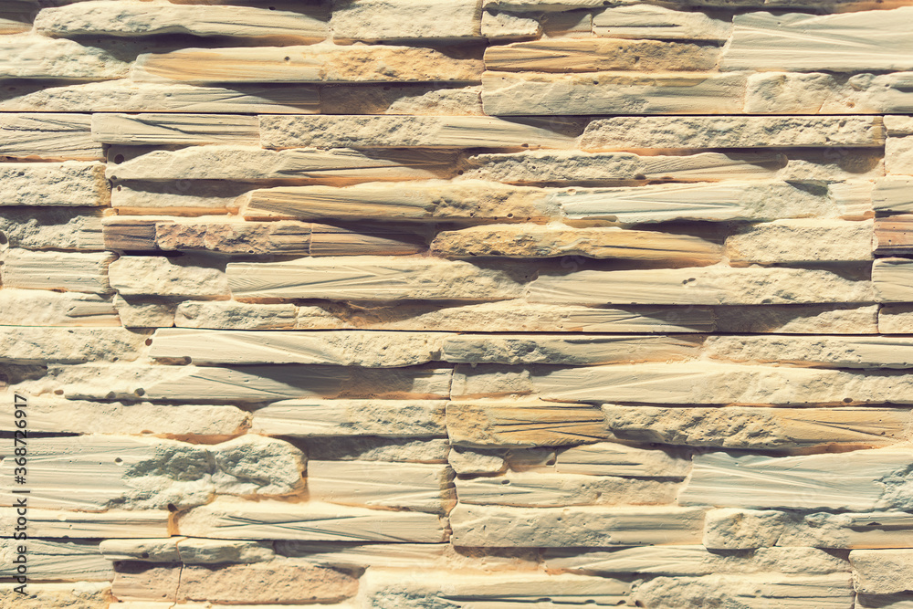 Stacked stone wall, natural stone cladding. Stone wall for background ...
