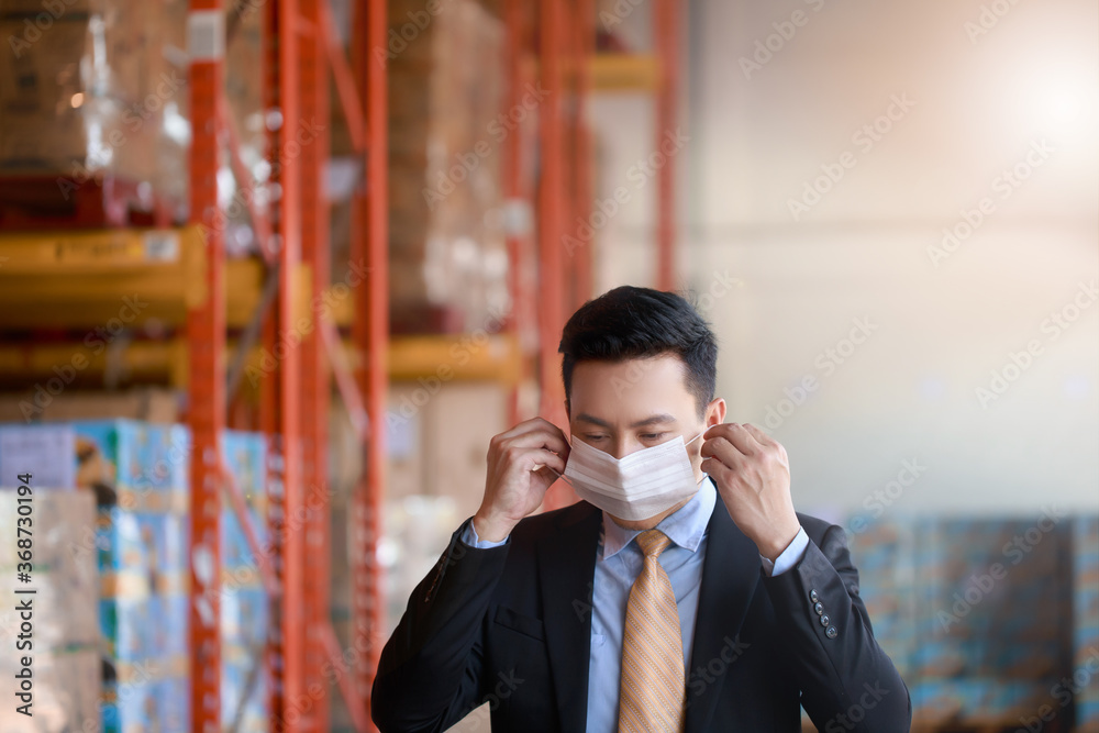 portrait of Asian male business owner wearing protective face mask ...