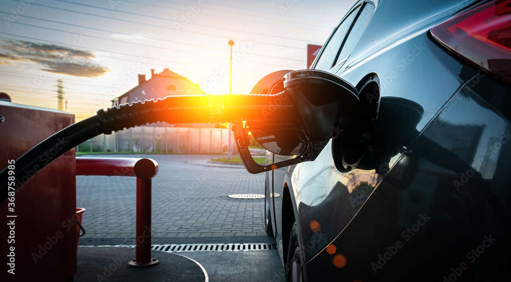 Refueling car. Pump gas at petrol fuel station. Gasoline oil nozzle ...