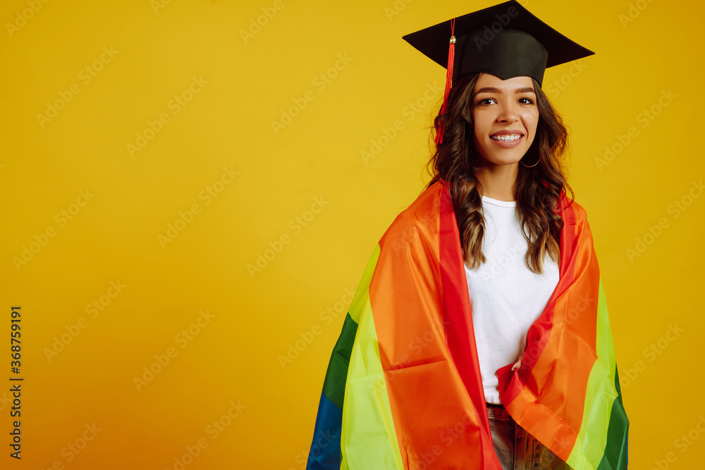 Beautiful African American lesbian girl in a graduation hat posing with ...