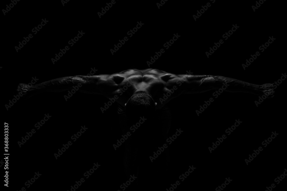 The bodybuilder has spread both arms and snapped a photo from above ...