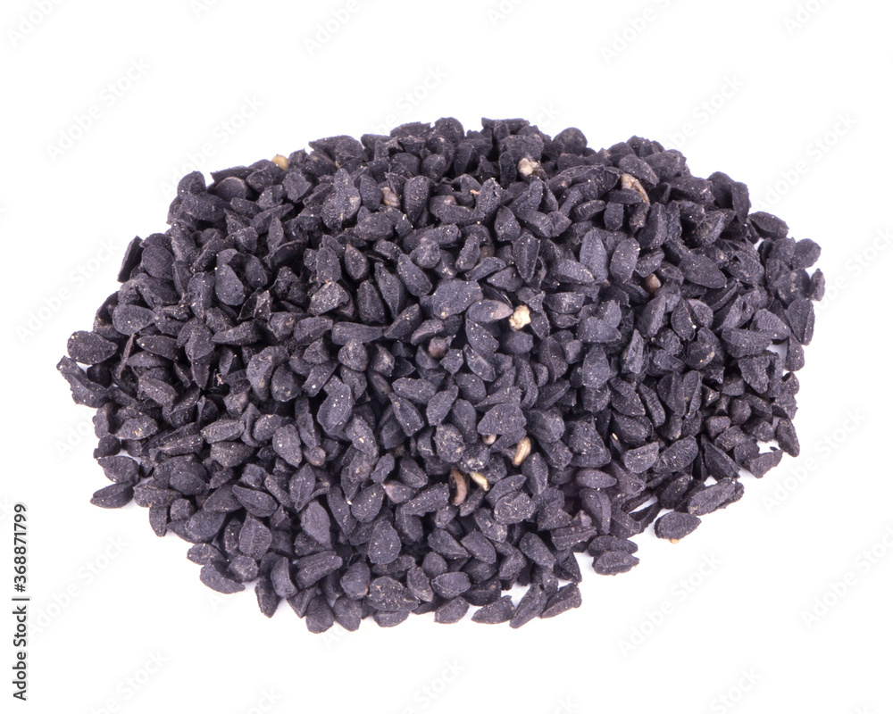 black cumin, stacked in a pile and isolated on white background Stock ...