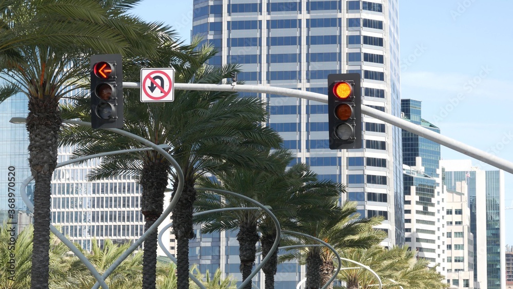 Traffic light and caution sign, road intersection in USA ...