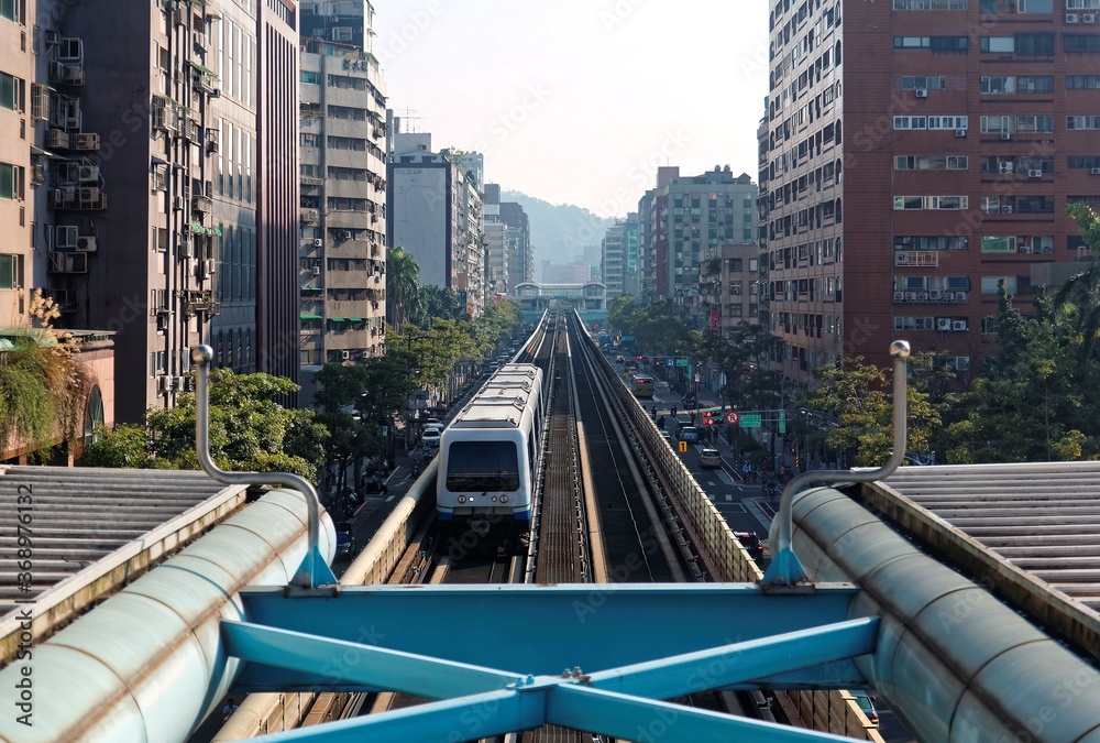 View of a train traveling on elevated rails of Taipei Metro System ...