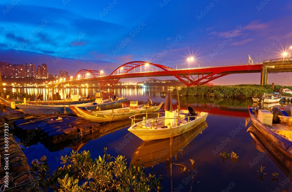 Early morning scenery of boats parking by riverside and in the ...