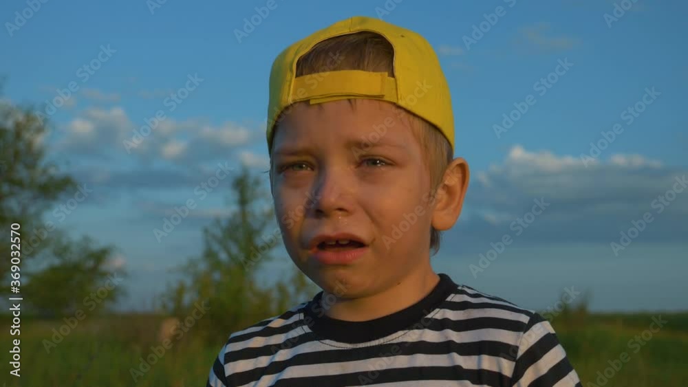 The isolated child is hysterical, tears flow down his face. The boy ...