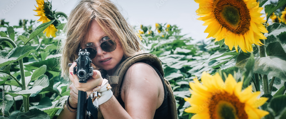 Beautiful and attractive woman soldier with rifle machine gun. Front ...