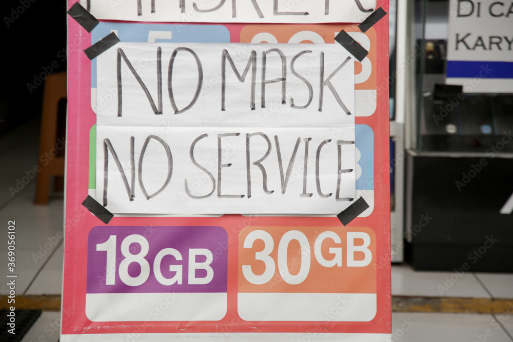 No mask no service sign in front of the shop. Safety measures during ...