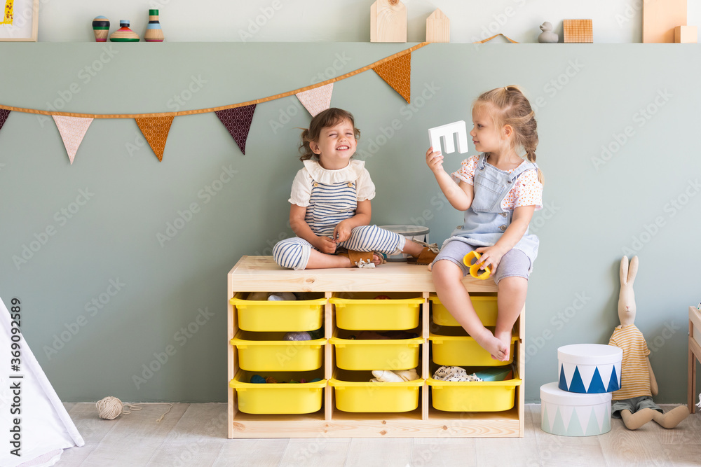 Little Girls Playing Guess Who Stock Photo | Adobe Stock