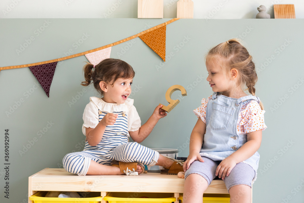Little Girls Playing Guess Who Stock Photo | Adobe Stock