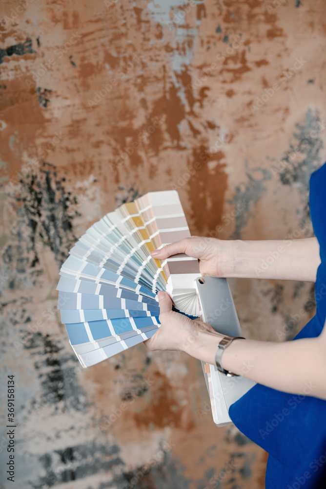 Designer holding color palette with different shades. Stock Photo ...