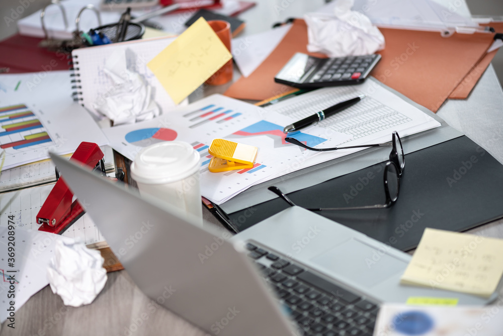 Messy and cluttered desk Stock Photo | Adobe Stock