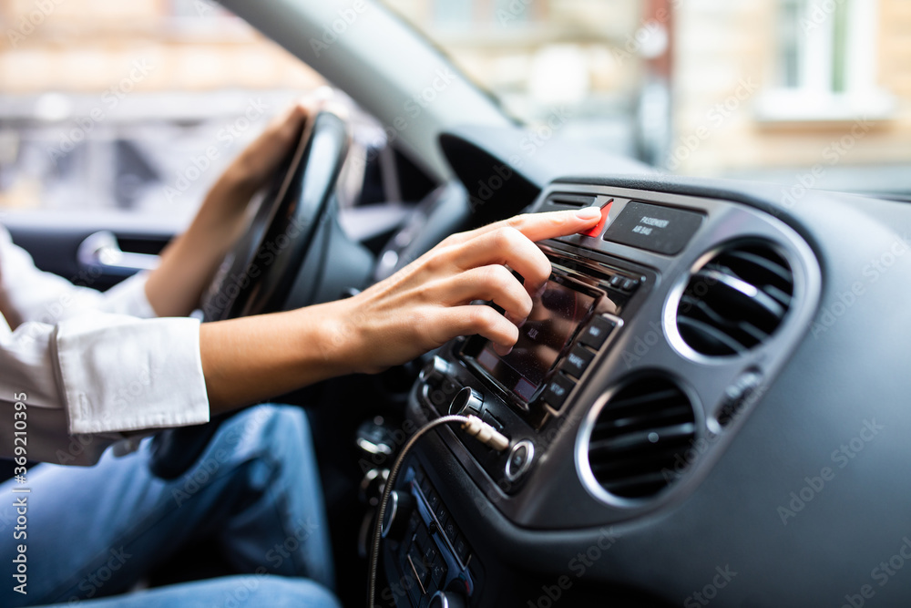 Young woman pressing emergency button on car dashboard Stock Photo ...