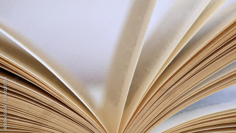 Wind gently moves the yellow opened book pages , footage for ...