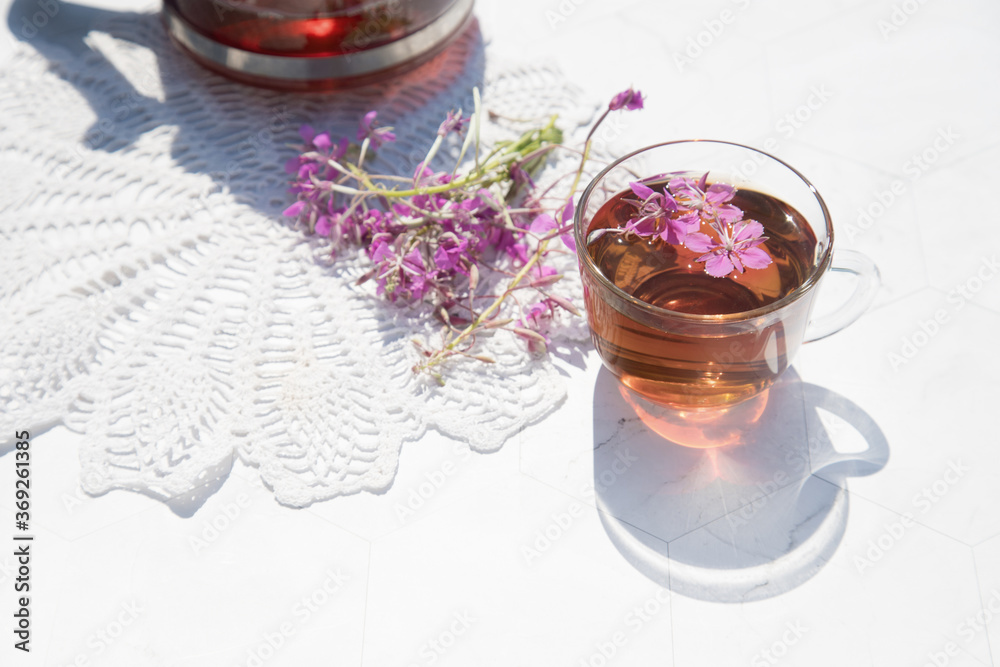 Herbal tea from fermented kipreya leaves in a glass Cup on a light ...