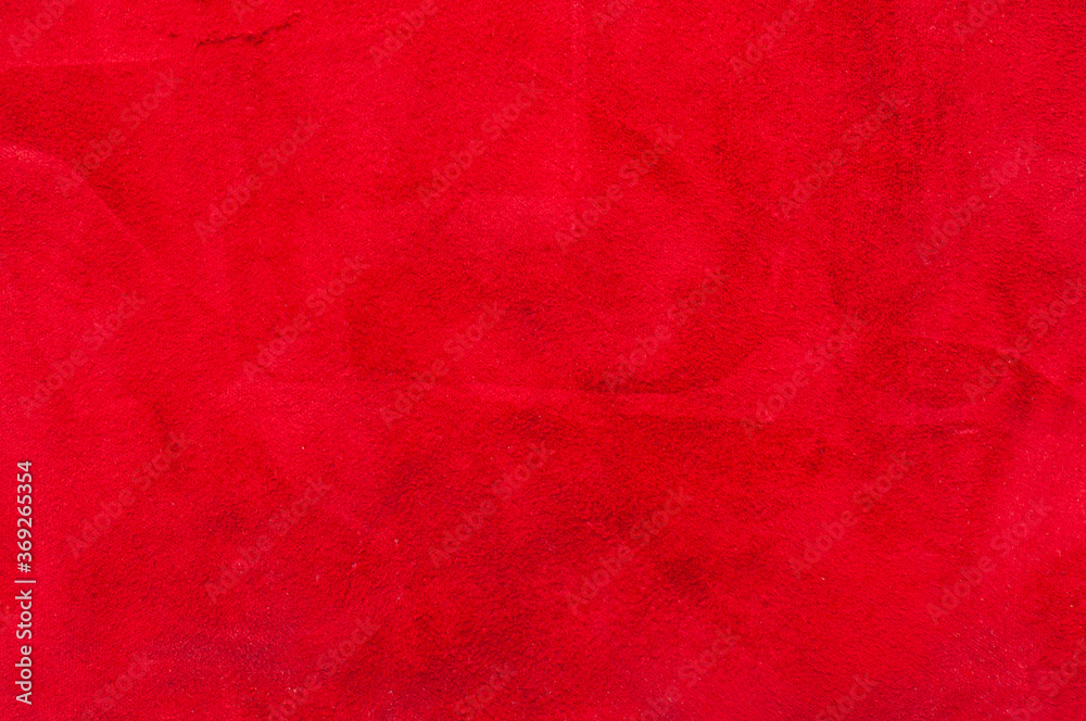 red matte background of suede fabric, closeup. Velvet texture of ...