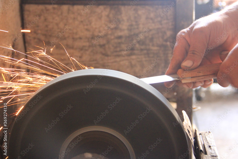 Sparks grinding wheel while knife sharpening Stock Photo | Adobe Stock