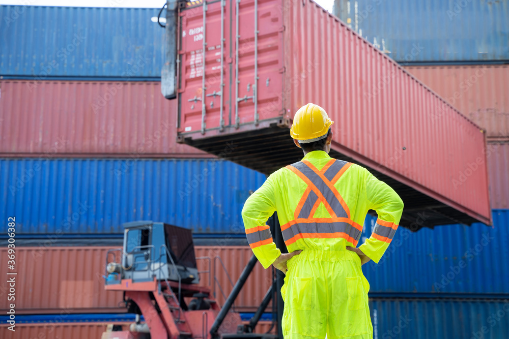 Container worker checking container box for logistic export and import ...