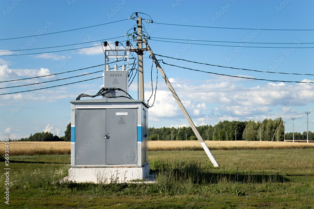 Transformer substation. Electrical high voltage transformer at field in ...