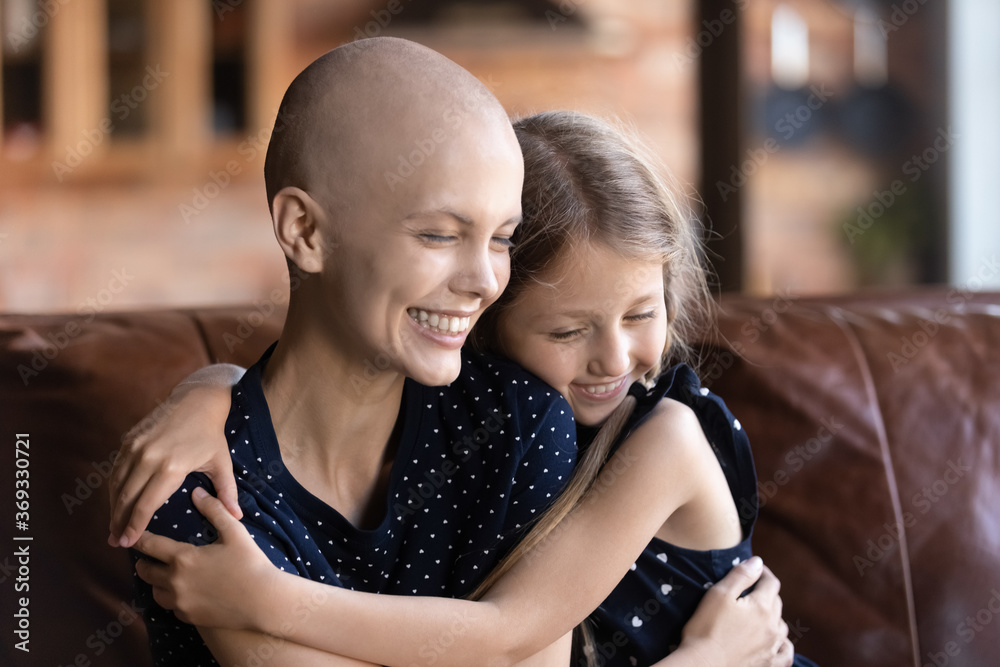Cute little girl hug cuddle sick cancer patient hairless mom show love ...