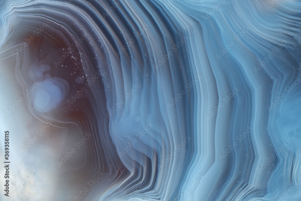 Full-screen texture of natural red-blue agate stone with a smooth ...