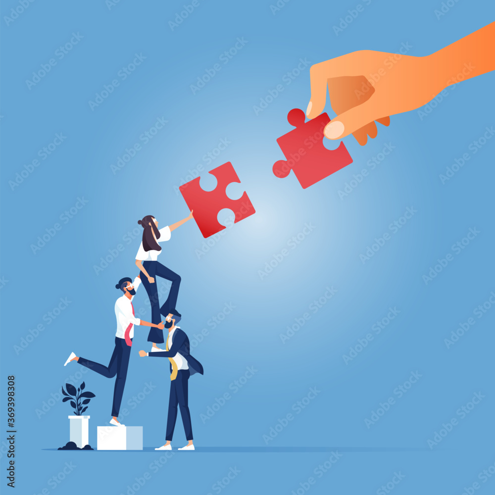 Partnership concept-Business team pushing big jigsaw piece towards each ...
